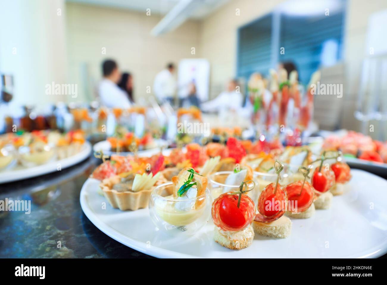 Catering in the office. A table with canapes and various snacks served ...