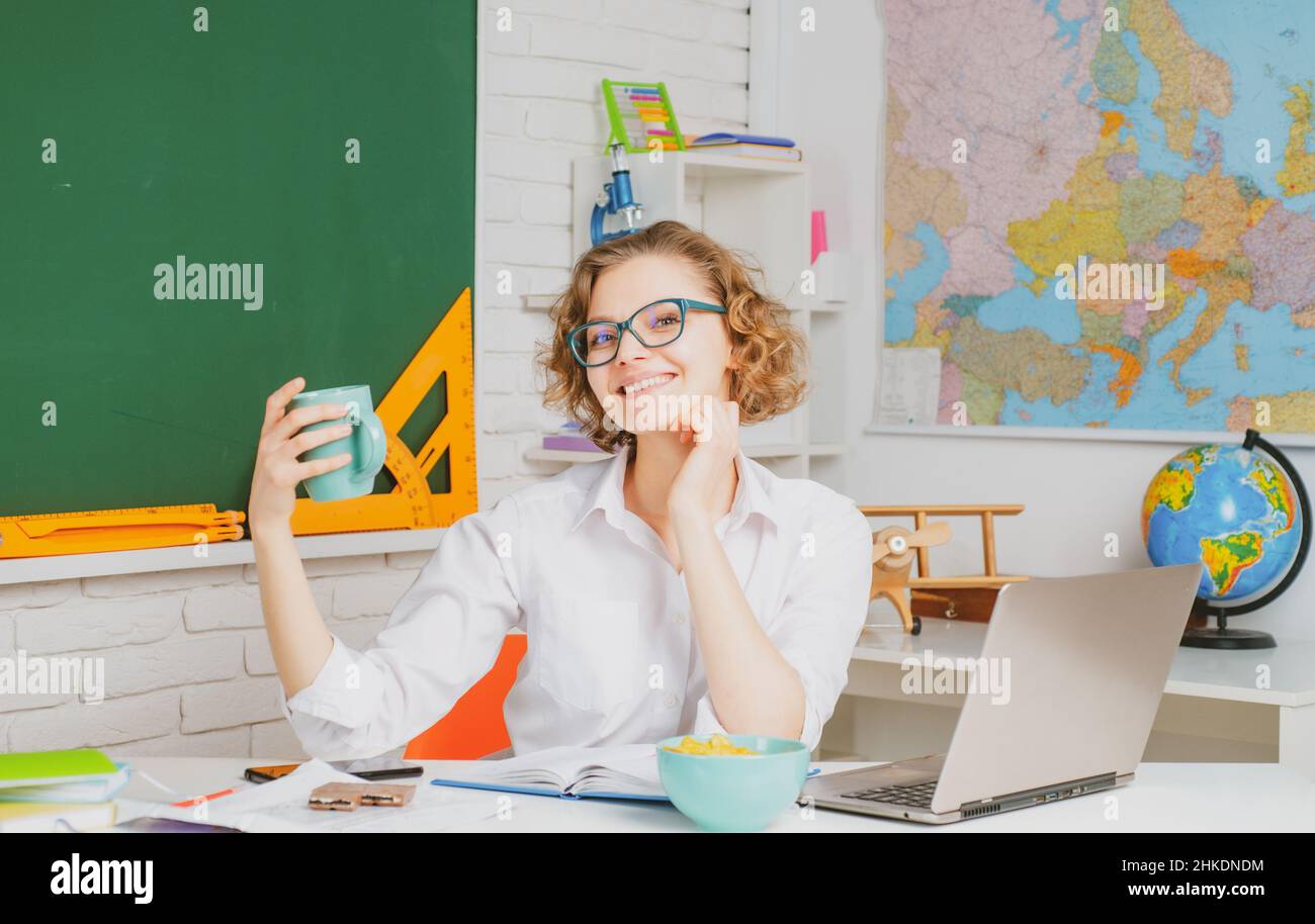 Modern attractive teacher. Portrait of smart young teacher in glasses ...