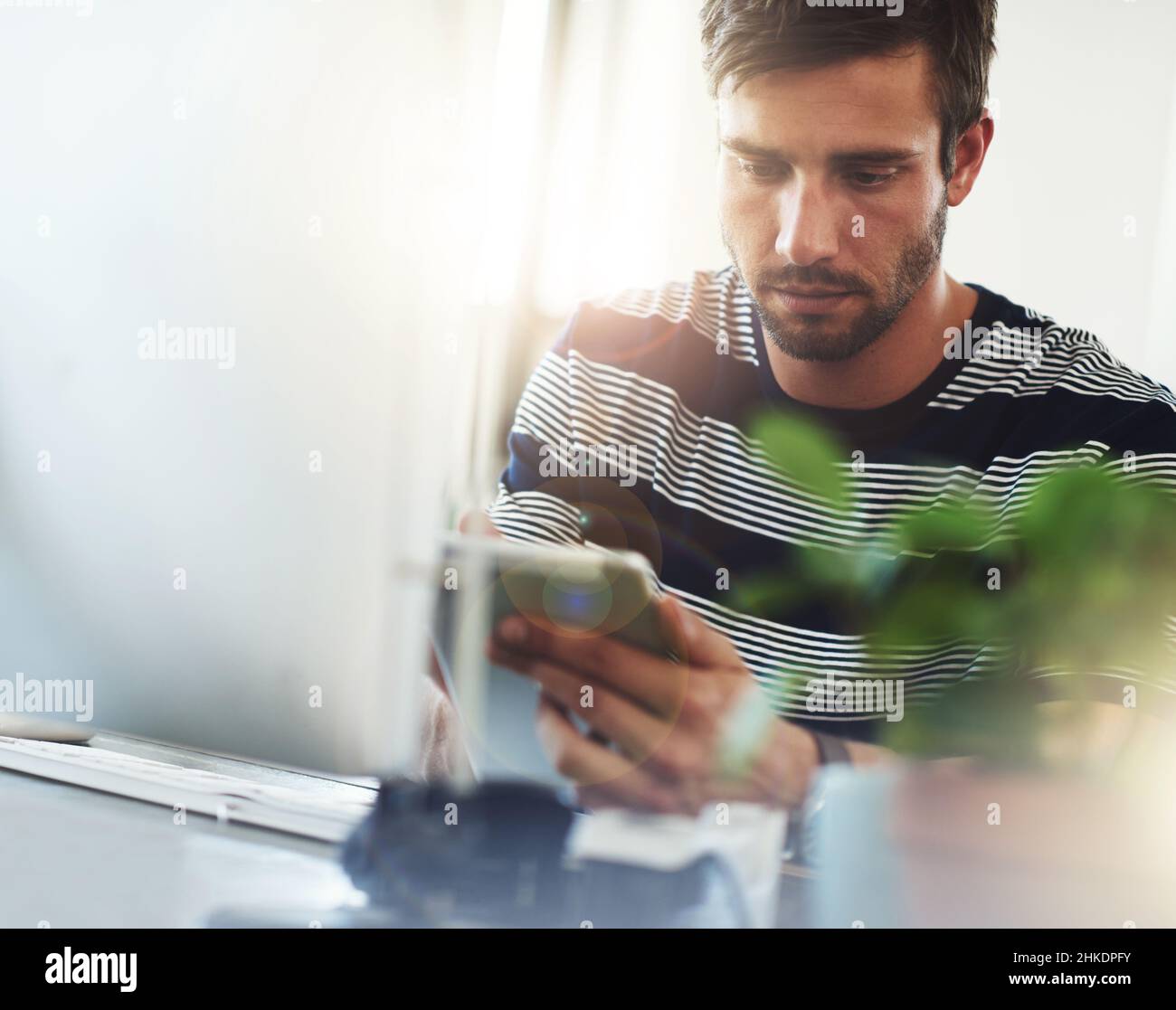 Always designing, always creating. Shot of a designer using his digital ...