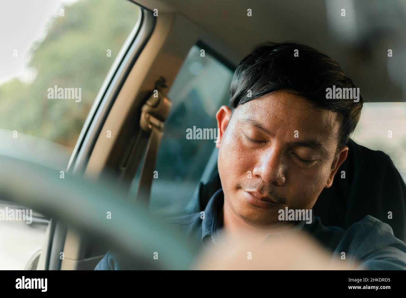 A man uses his phone while driving and falls asleep while driving Stock ...