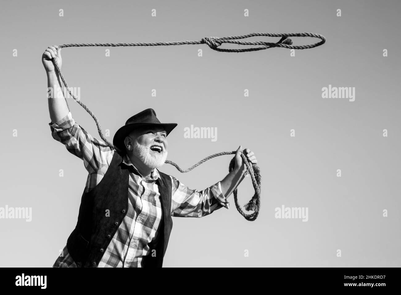 Cowboy roping cattle Black and White Stock Photos & Images - Alamy