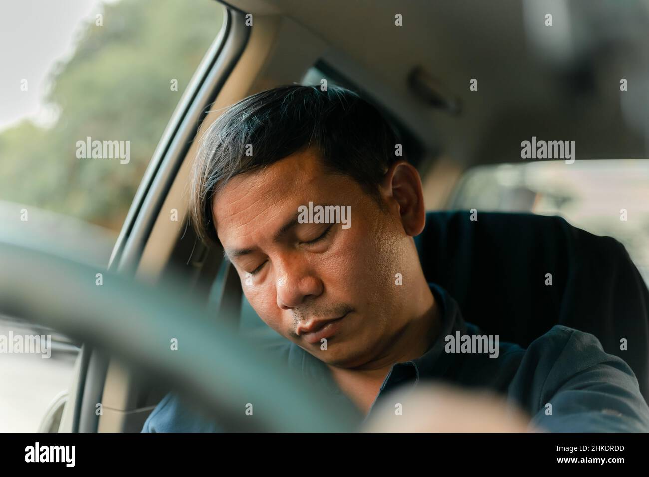 A man uses his phone while driving and falls asleep while driving Stock ...