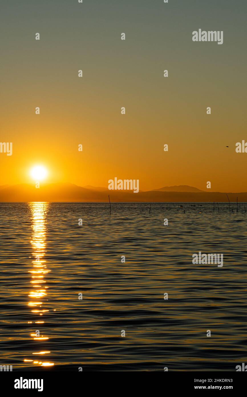 Vertical shot of a bright sunset sky over Alba River Stock Photo - Alamy