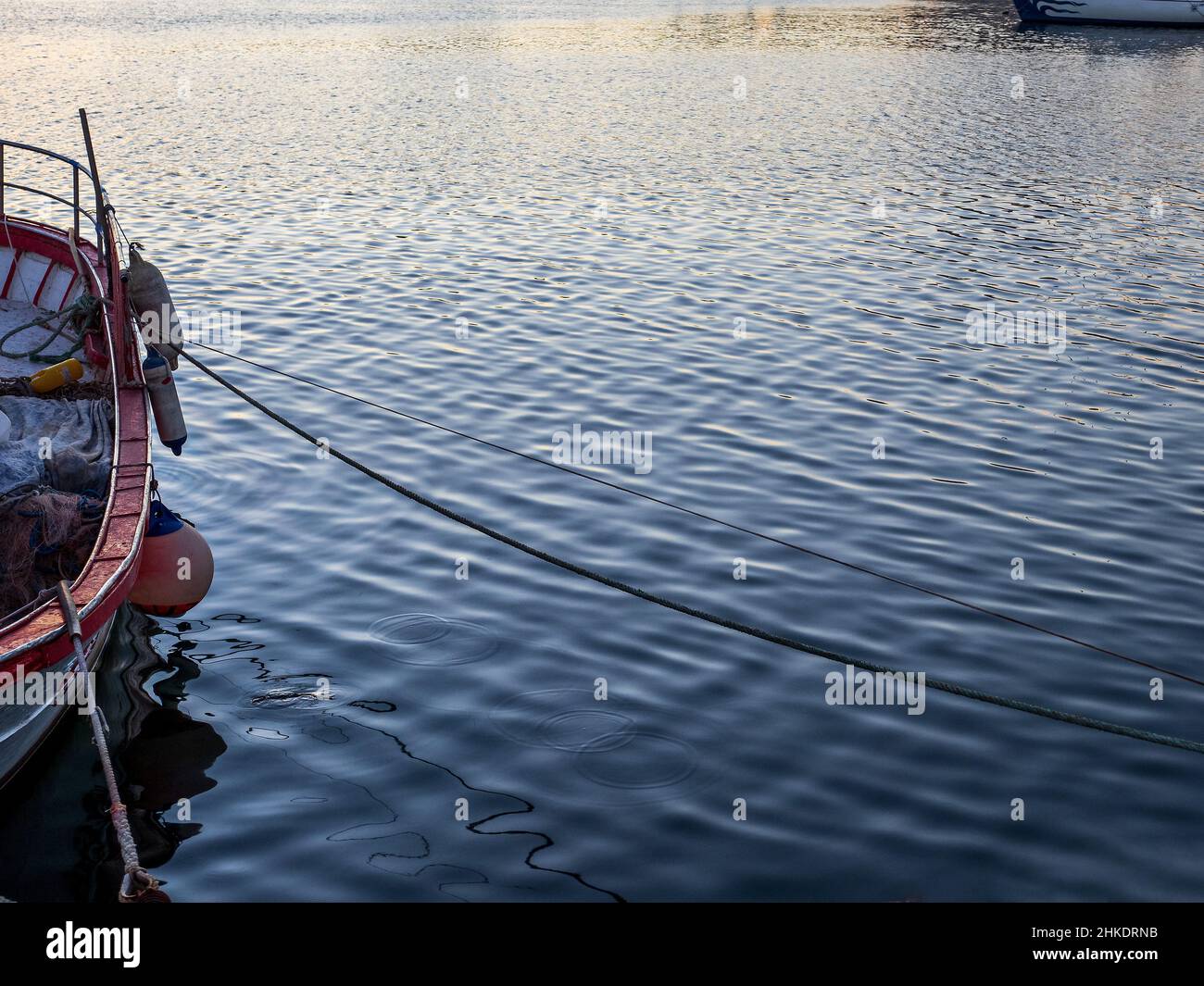 Closeup of ropes on an old boat on the sea under the sunlight Stock ...