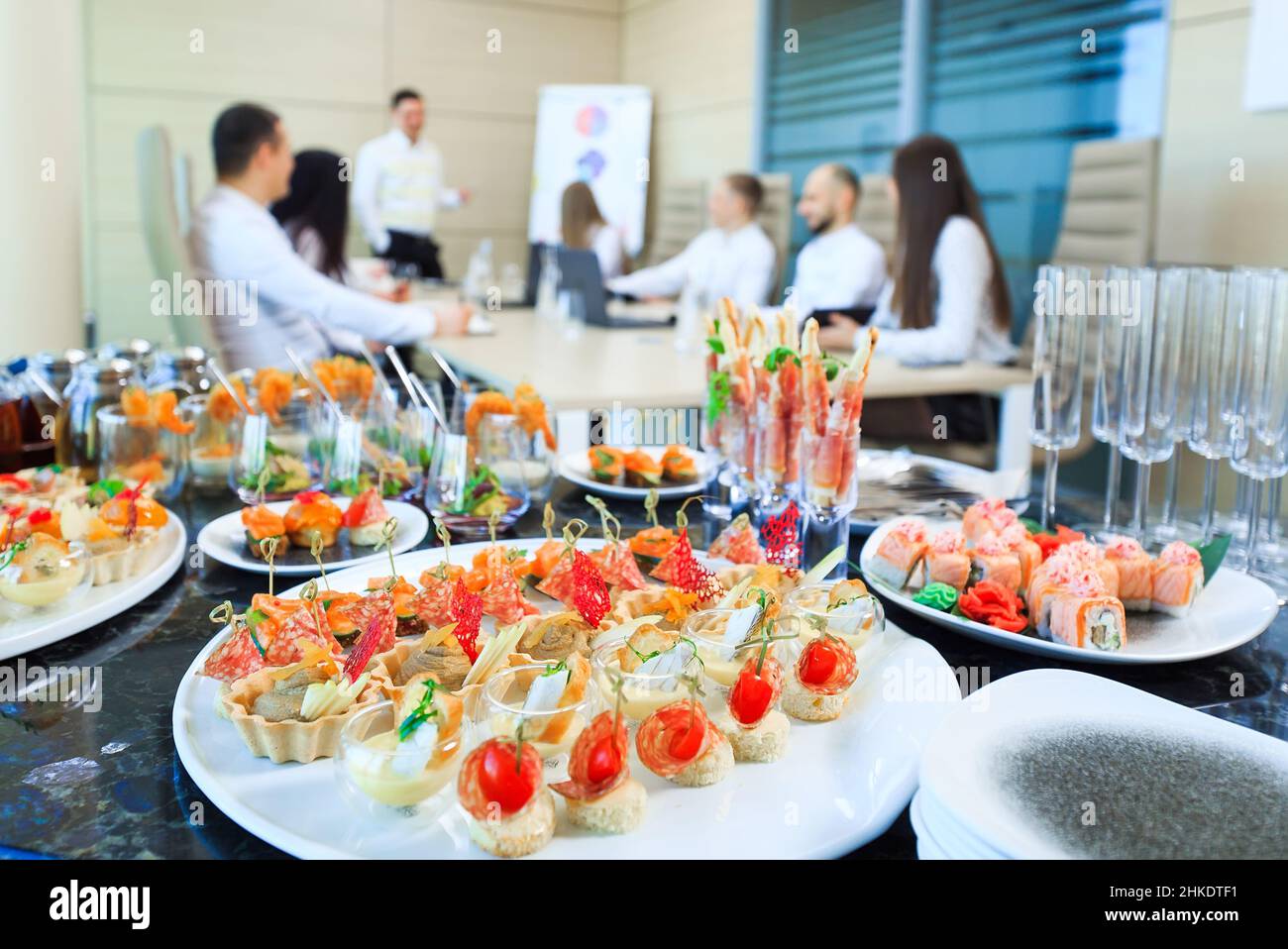 Catering in the office. A table with canapes and various snacks served ...
