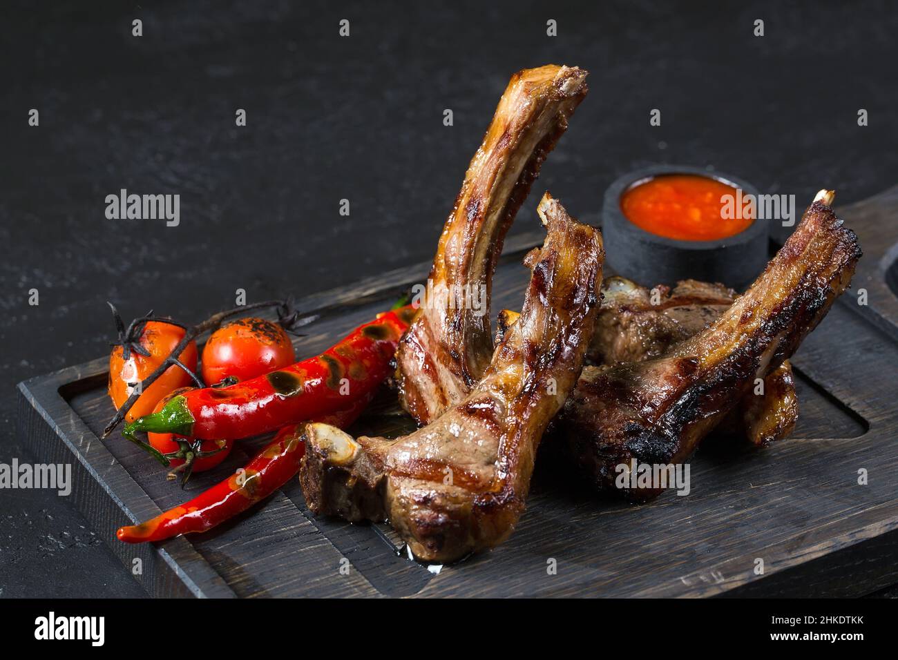 lamb square with hot pepper on a wooden board Stock Photo - Alamy
