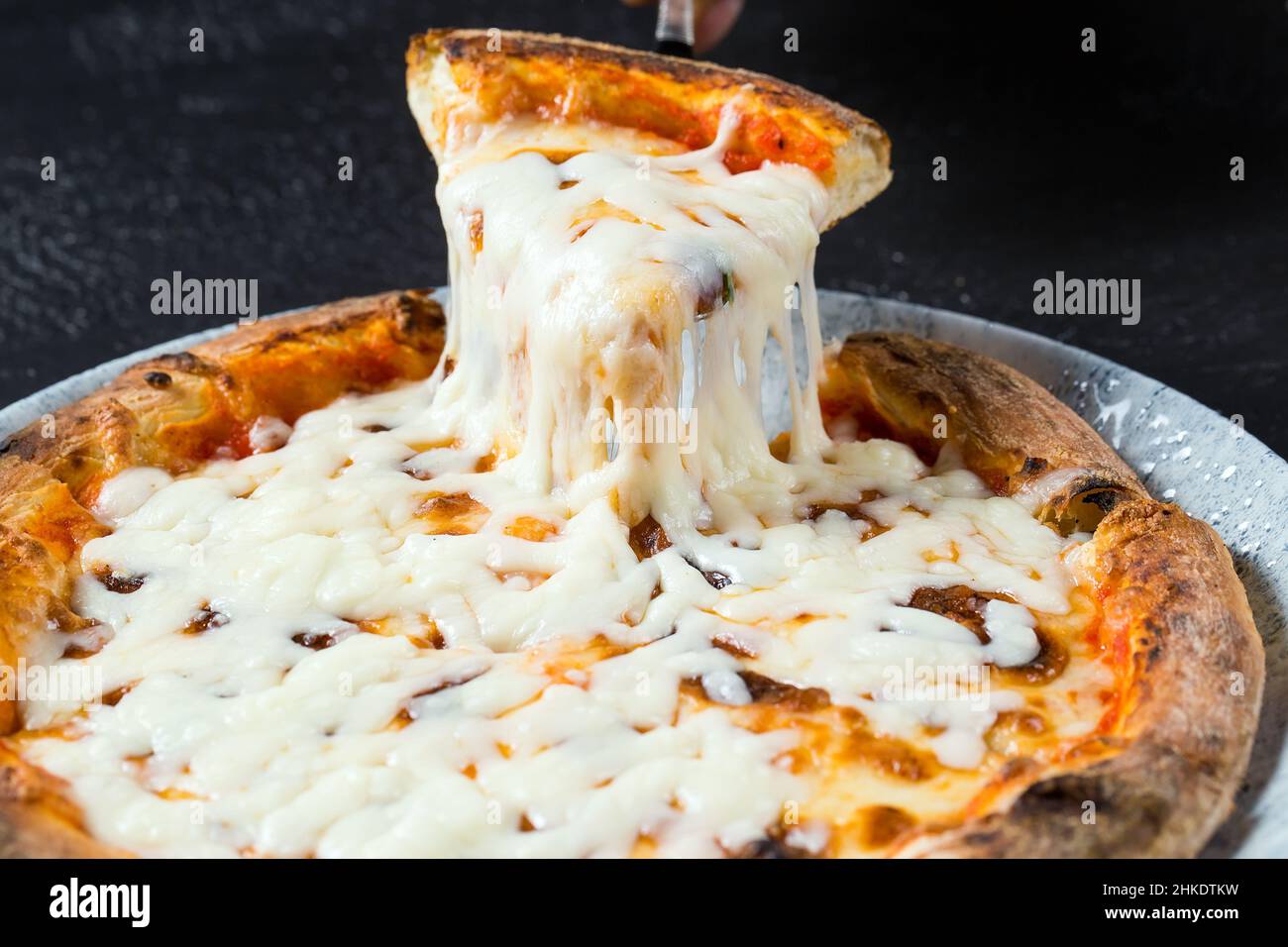 Tasty take slice of pizza with cheese. Appetizing separate piece of ...