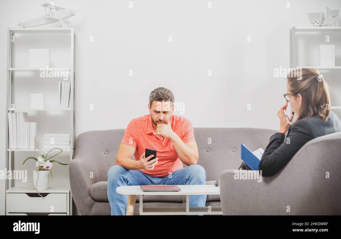 Social worker psychologist talking to man. Depression counseling ...