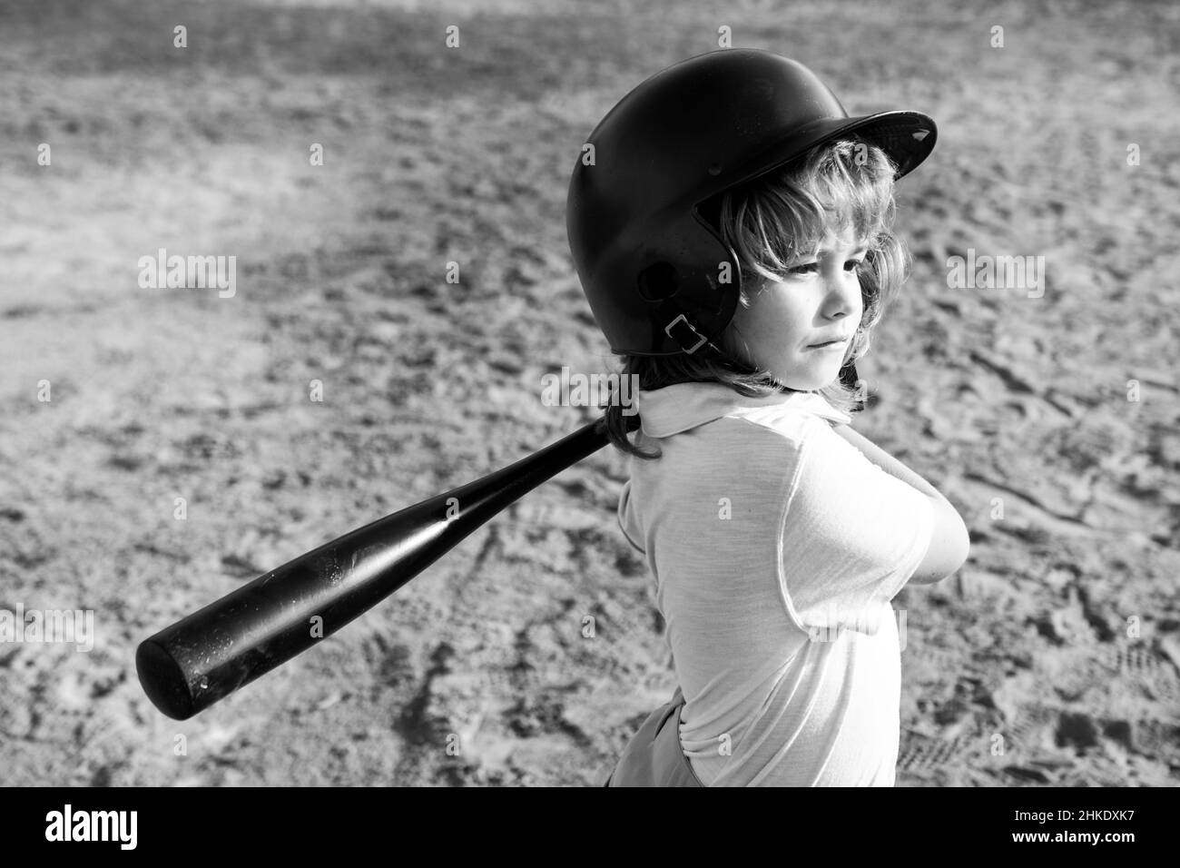Child baseball player focused ready to bat. Kid holding a baseball bat ...
