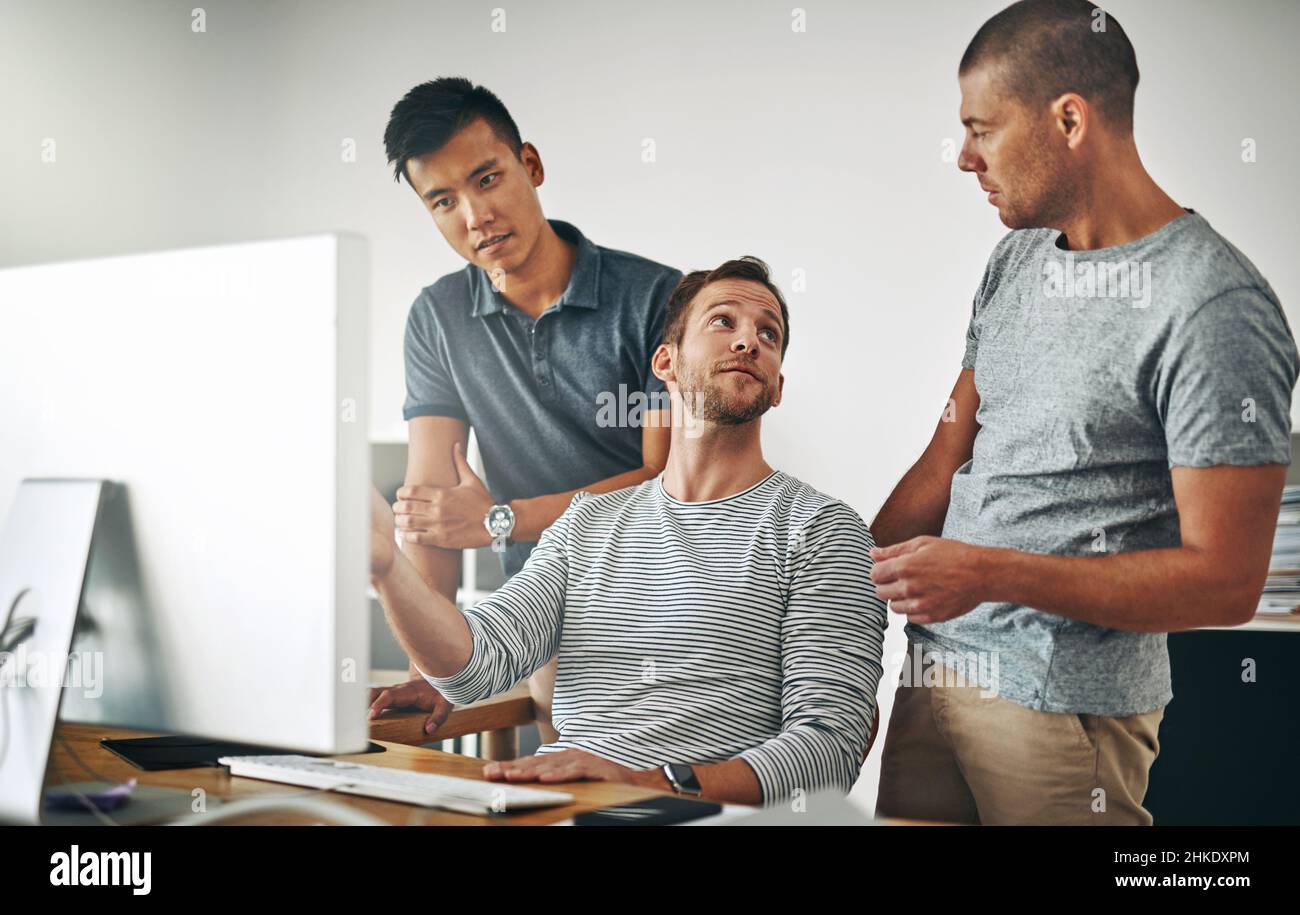 Creating a visual solution. Cropped shot of three designers working ...