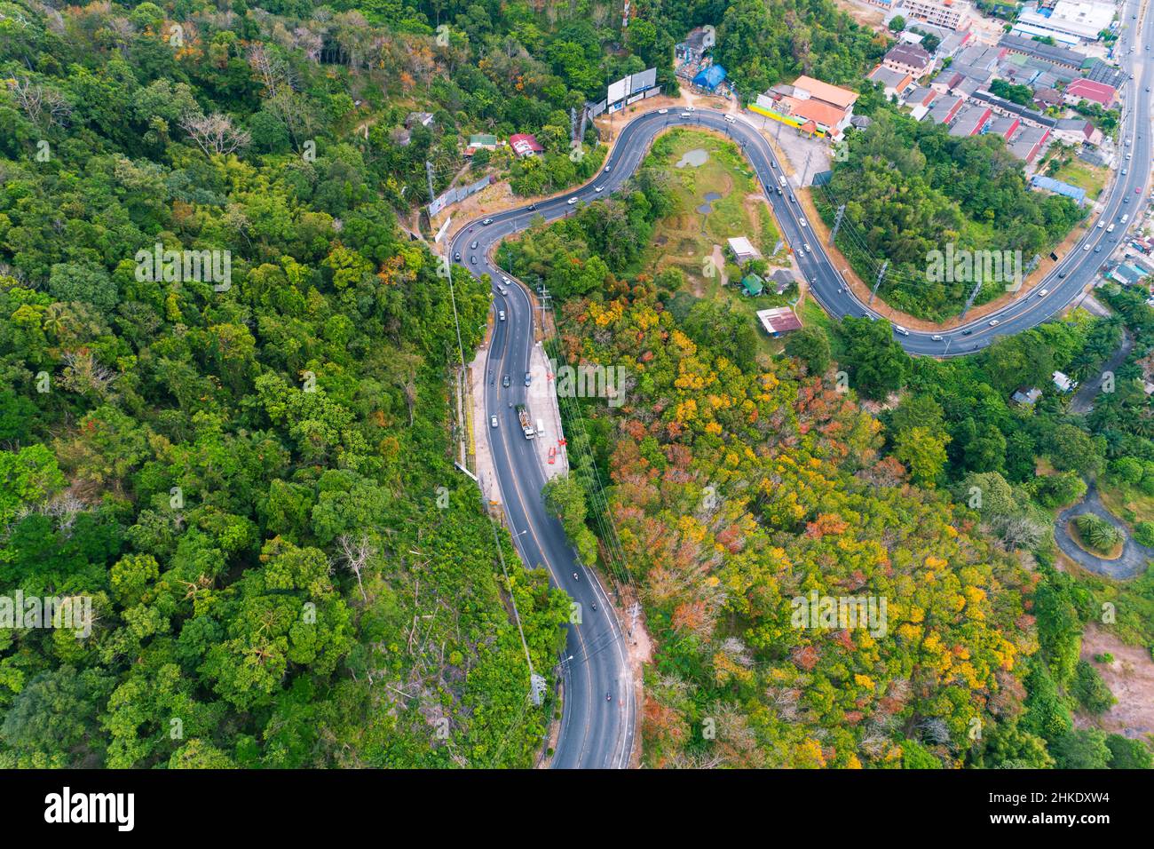 Aerial view of mountain road in forest in autumn season Top view from ...