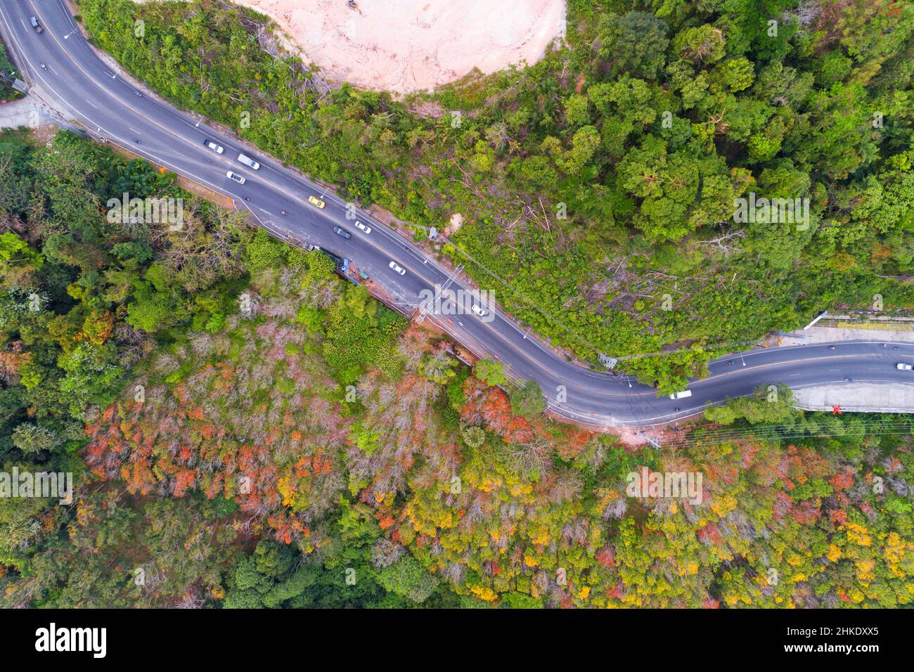 Aerial view of mountain road in forest in autumn season Top view from ...