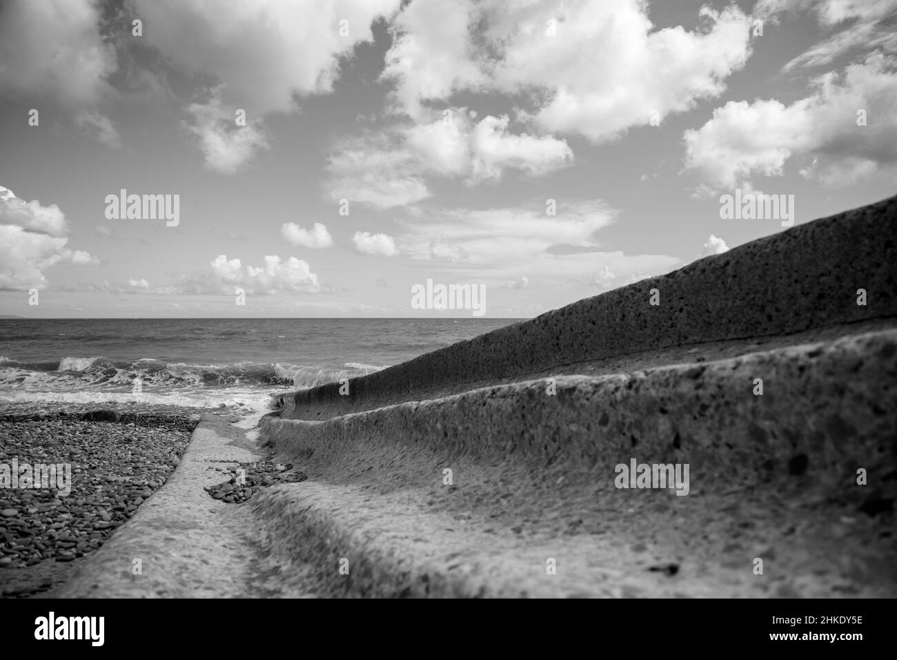Greyscale view of the Amroth Concrete Beach ramp, United Kingdom Stock ...
