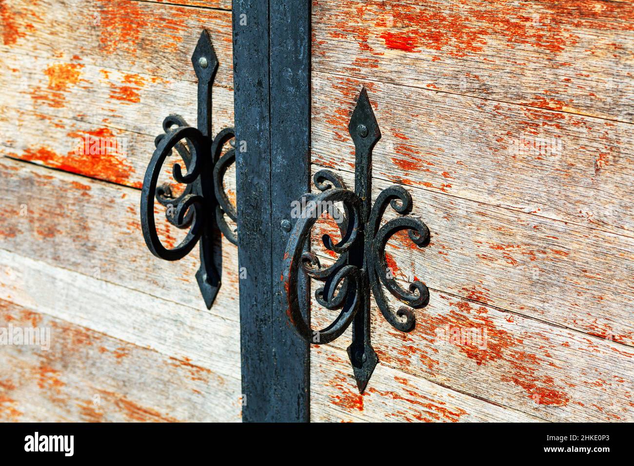 Forged door handles . Medieval wooden gate with iron handles Stock ...