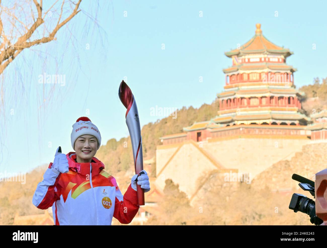 Beijing, China. 4th Feb, 2022. Torch bearer Ding Ning runs with the ...