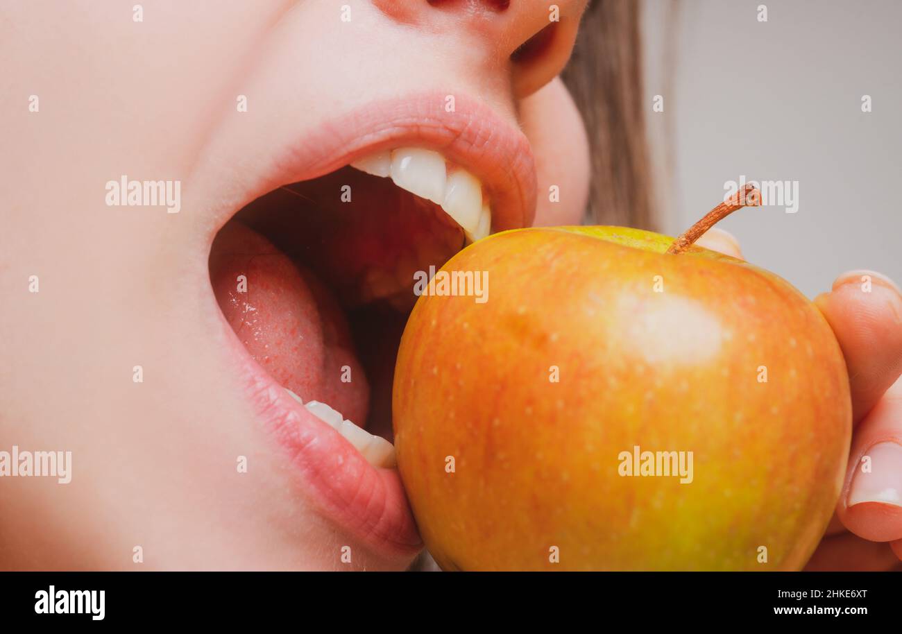Biting an apple. Mouth close up. Woman eating apple, natural lips Stock ...