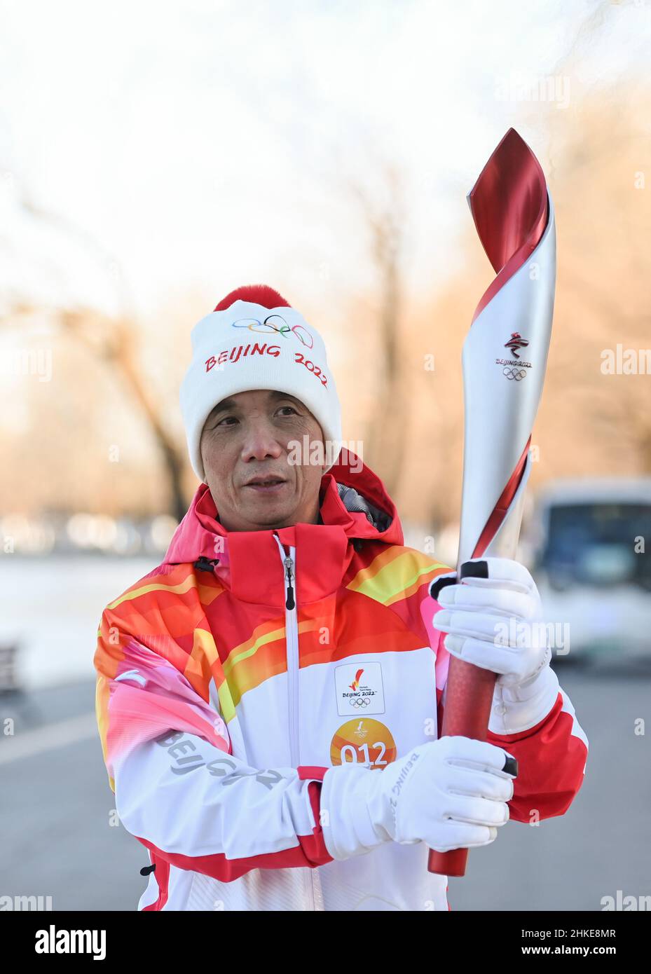 Beijing, China. 4th Feb, 2022. Torch bear Ke Yufa runs with the torch ...