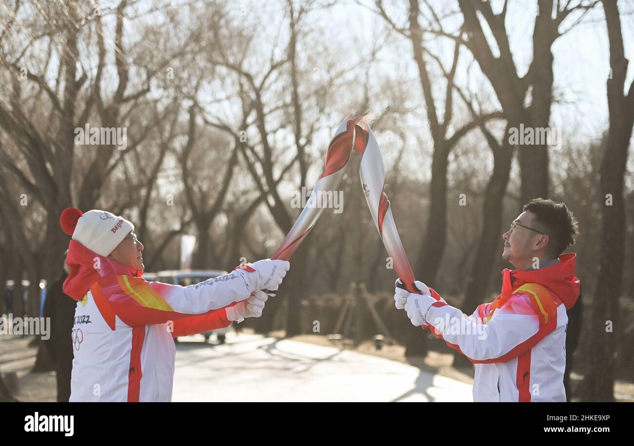 Beijing, China. 4th Feb, 2022. Torch bearers Li Feng (L) and Gao Pei ...