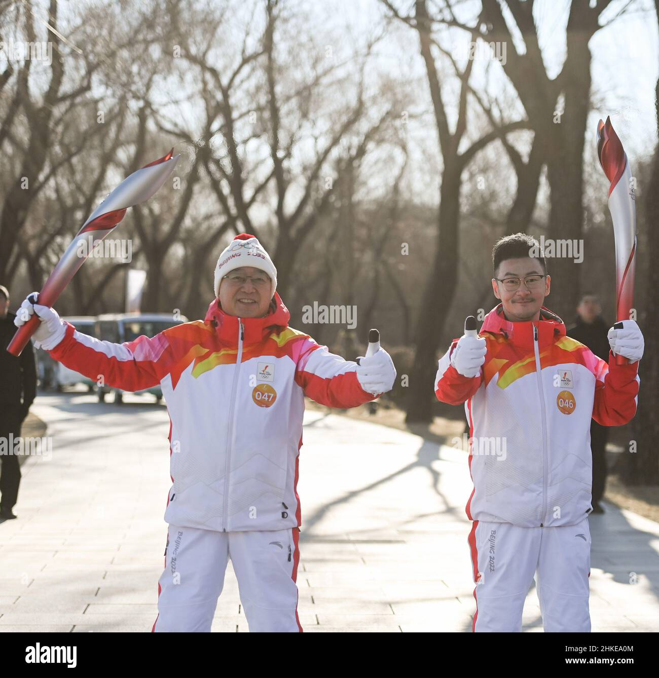 Beijing, China. 4th Feb, 2022. Torch bearers Li Feng (L) and Gao Pei ...