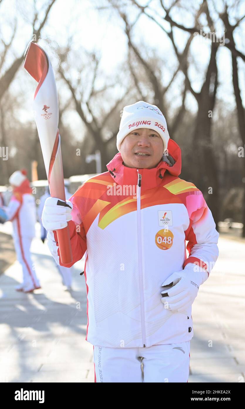 Beijing, China. 4th Feb, 2022. Torch bearer Yin Wen runs with the torch ...