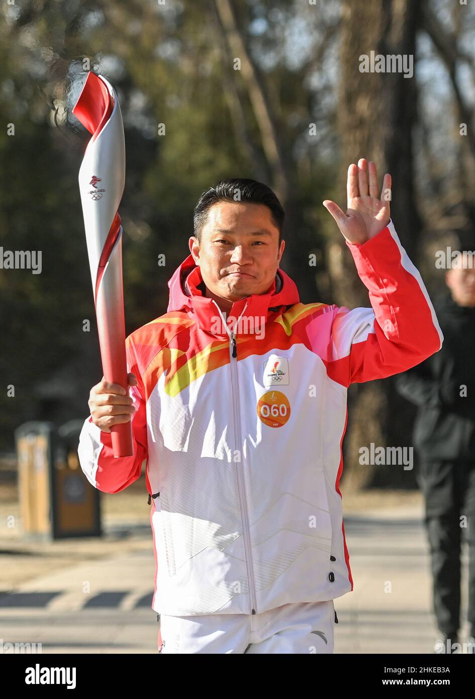 Beijing, China. 4th Feb, 2022. Torch bearer Yang Chun runs with the torch during the Beijing ...