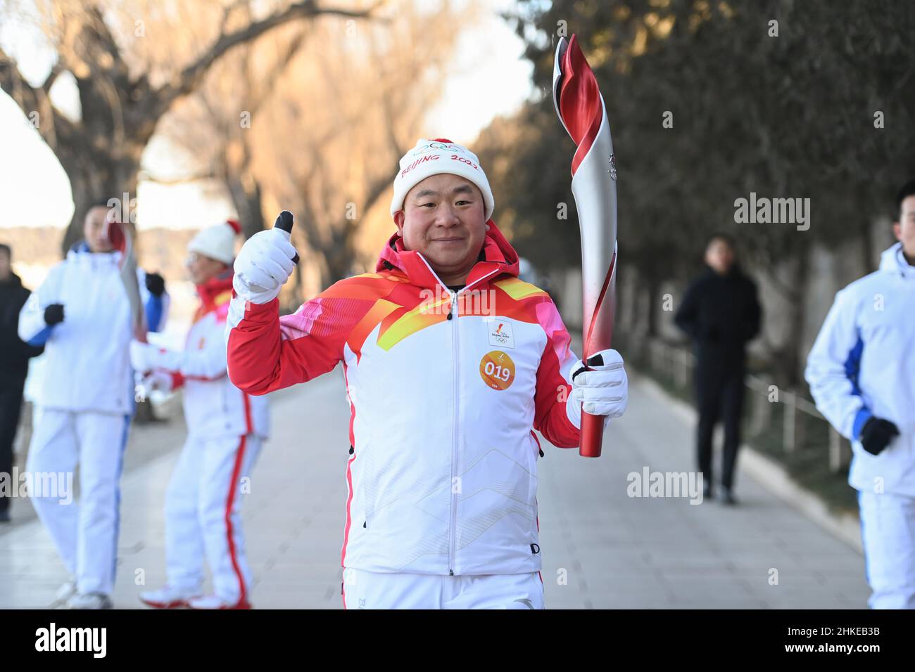 Beijing, China. 4th Feb, 2022. Torch bearer Zhao Xinlu runs with the torch during the Beijing ...