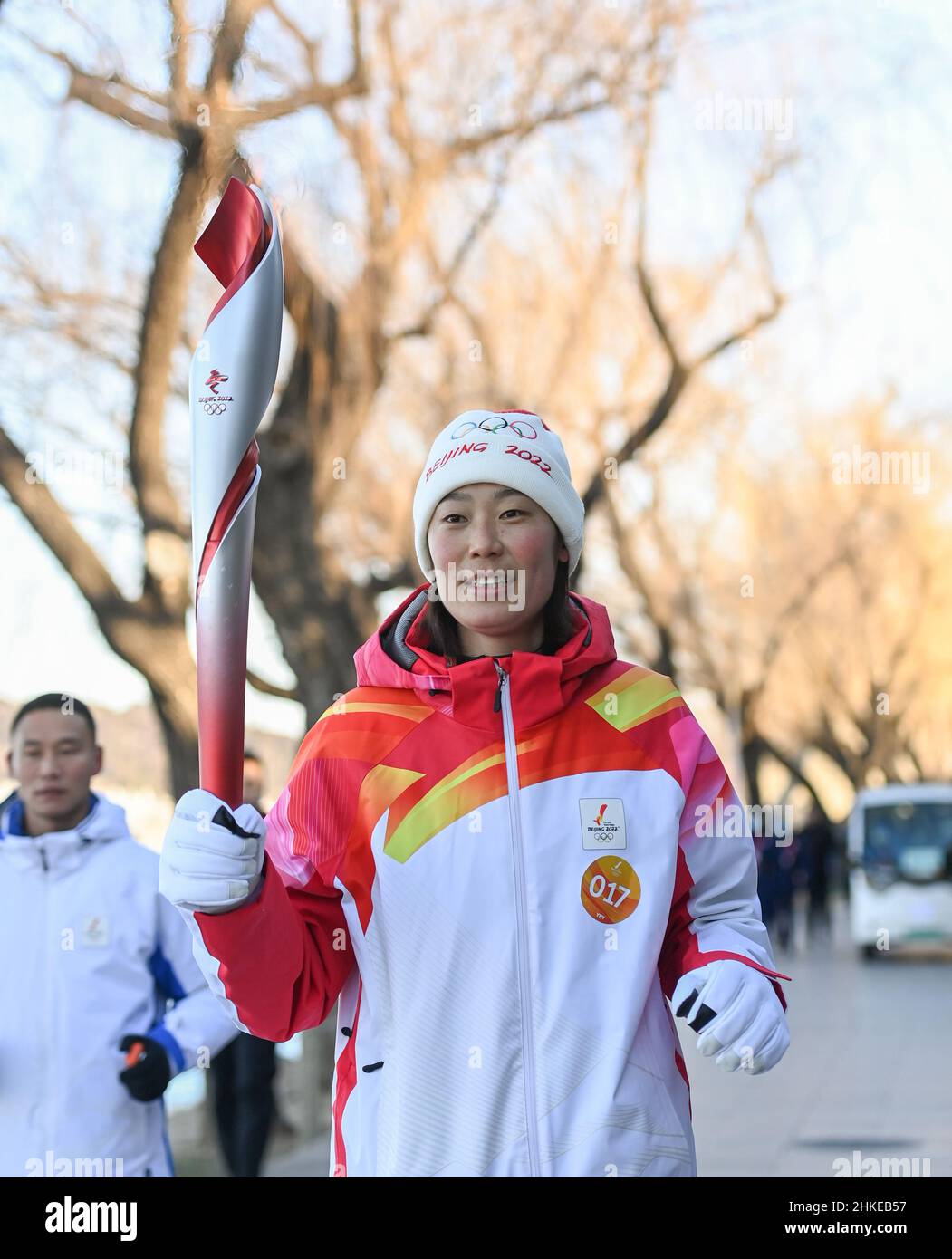 Beijing, China. 4th Feb, 2022. Torch bearer Zhu Ting runs with the torch during the Beijing 2022 ...