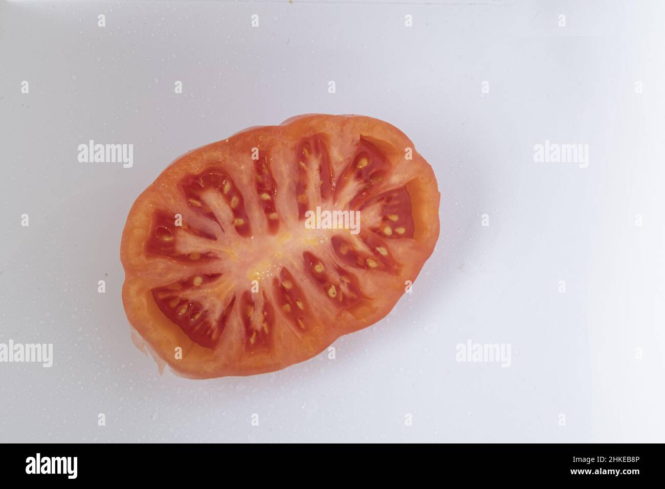 Top view of sliced ripe tomato isolated on white background Stock Photo ...