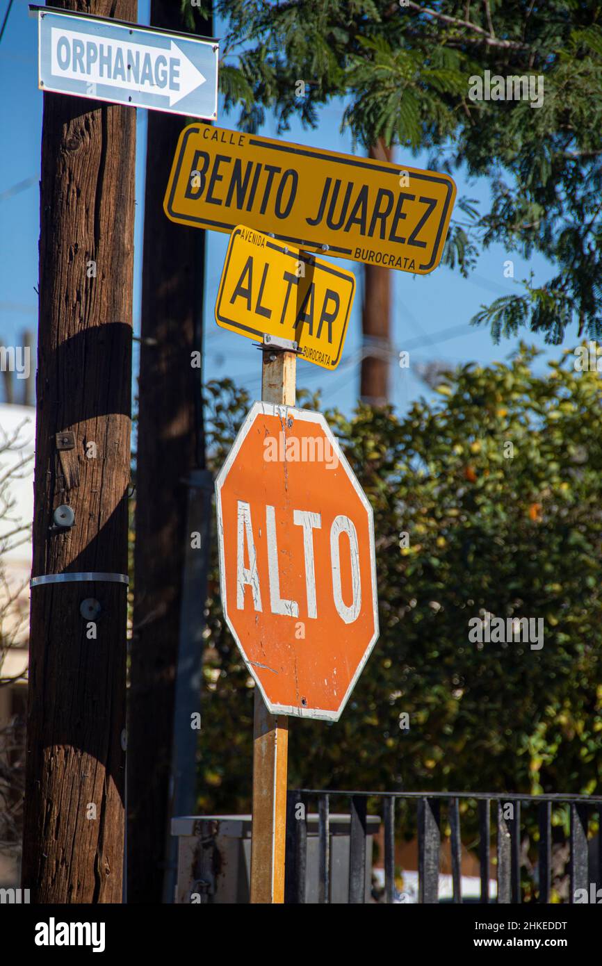 A street sign showing the direction of Benito Juarez and Altar. Also ...