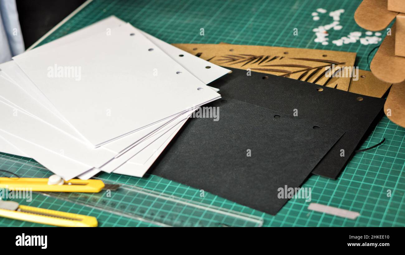 Paper with holes of hole puncher on table in warehouse. Punched paper ...