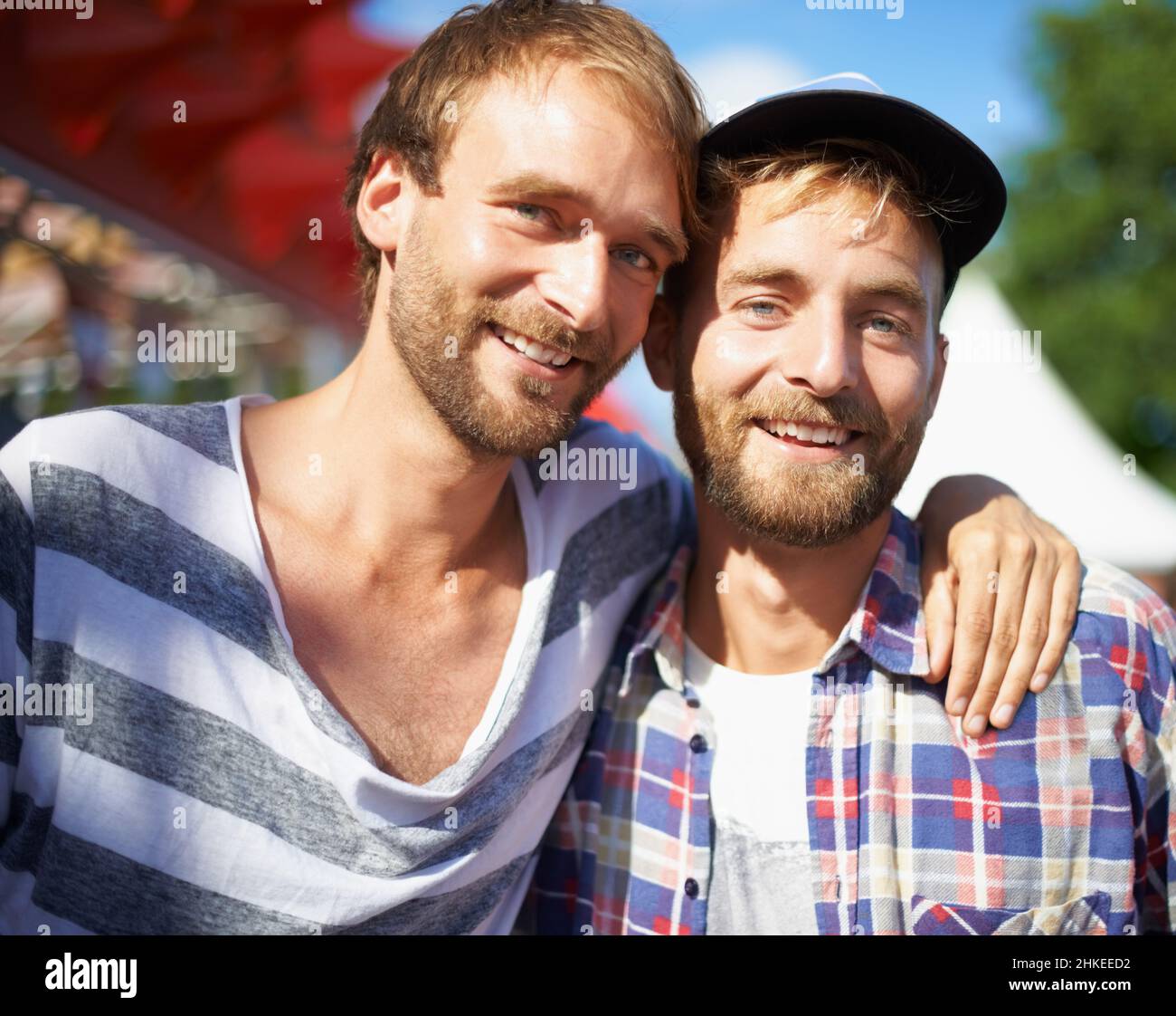 REady for the party. Portrait of young male friends enjoying themselves ...