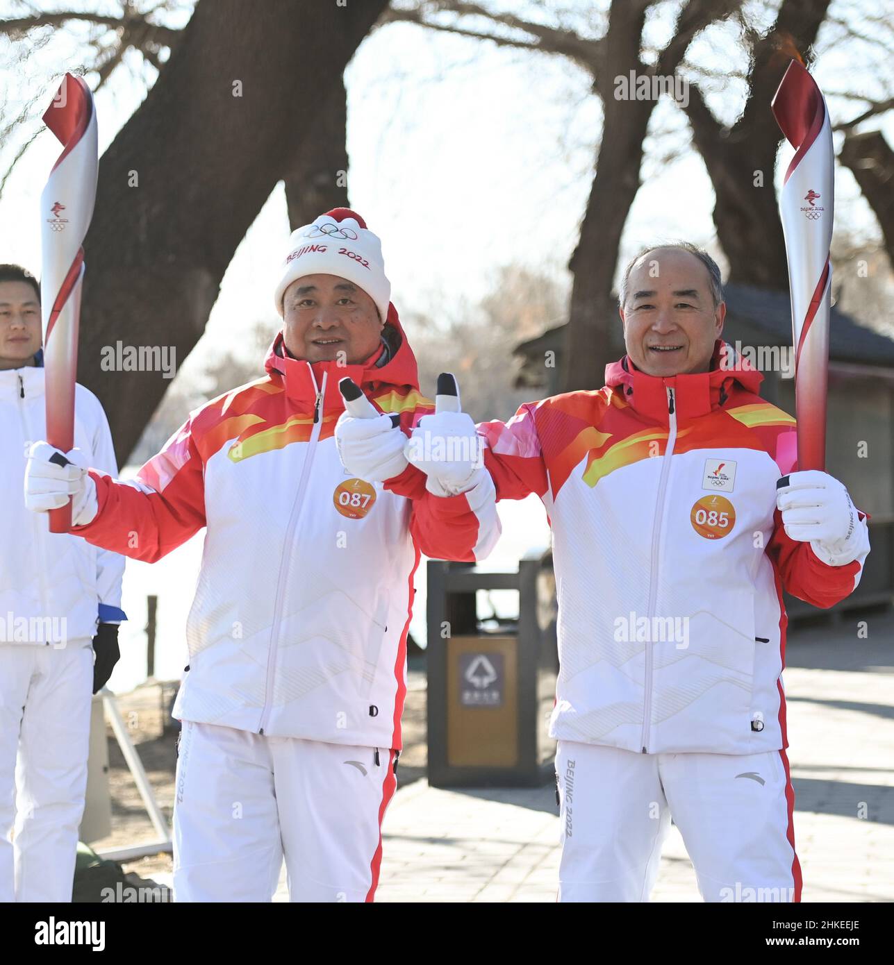 Beijing, China. 4th Feb, 2022. Torch bearers Shan Jixiang (L) and Chen Dongjie attend the ...