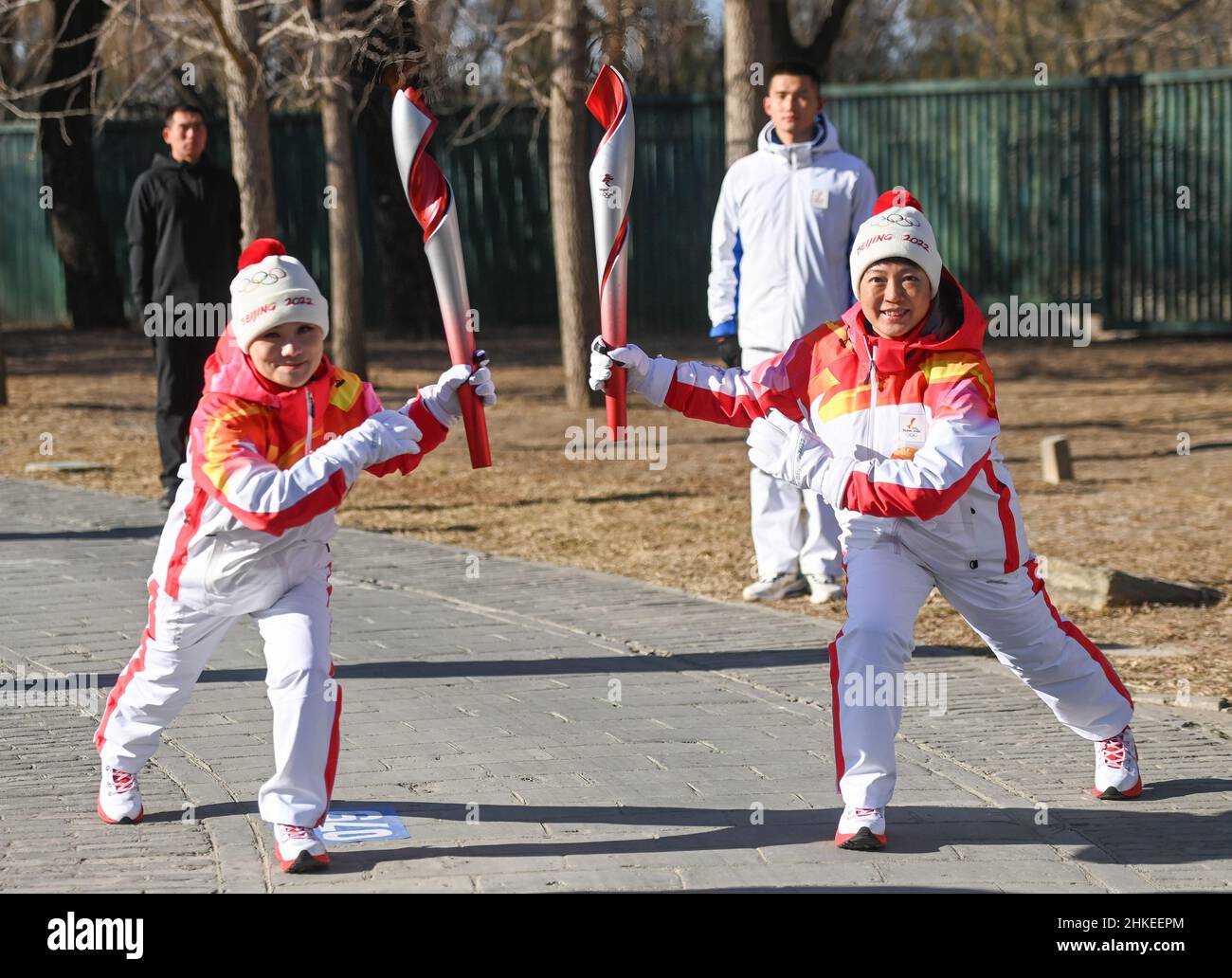 Beijing, China. 4th Feb, 2022. Torch bearers Quan Beiyi (L) and Wei ...