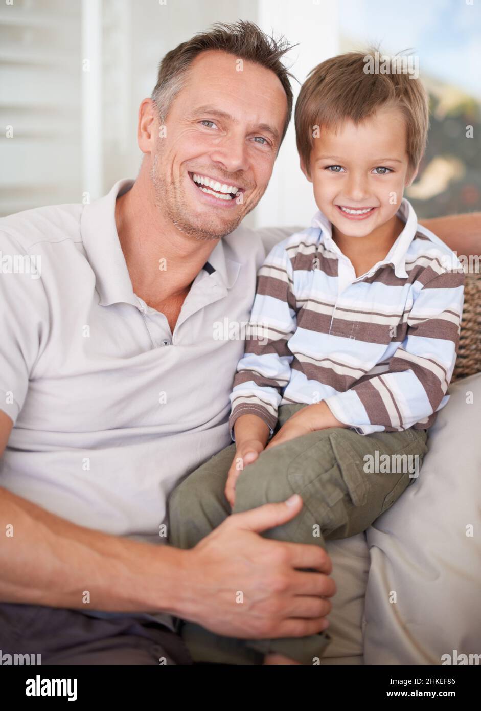 Sharing some father son time. Portrait of a father and son sitting ...