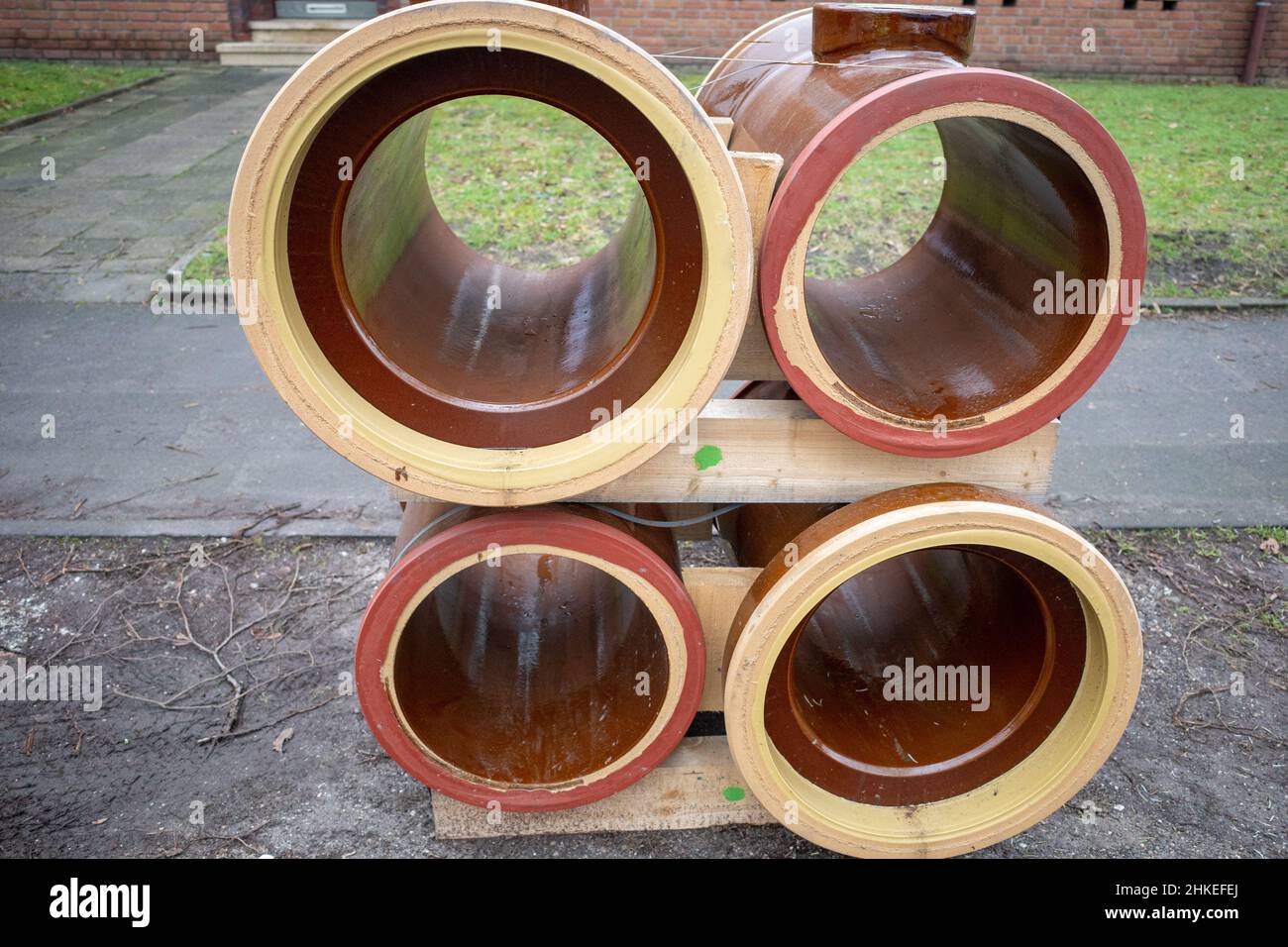 Various sizes of clay pipes for water pipes outdoors Stock Photo - Alamy