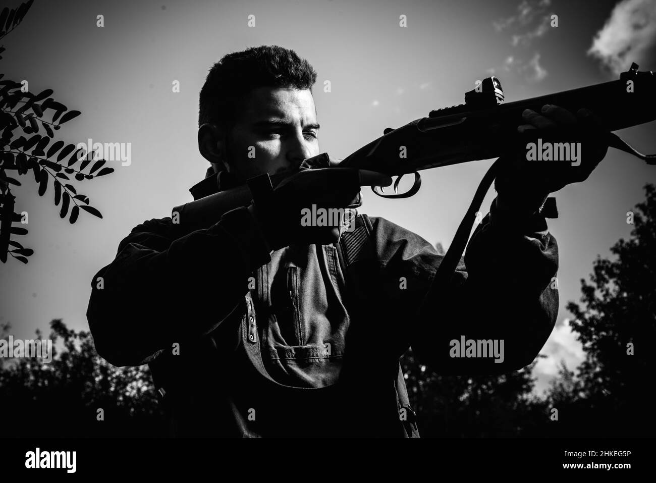 Hunting gun. Hunter aiming rifle in forest. Hunter with shotgun gun on ...