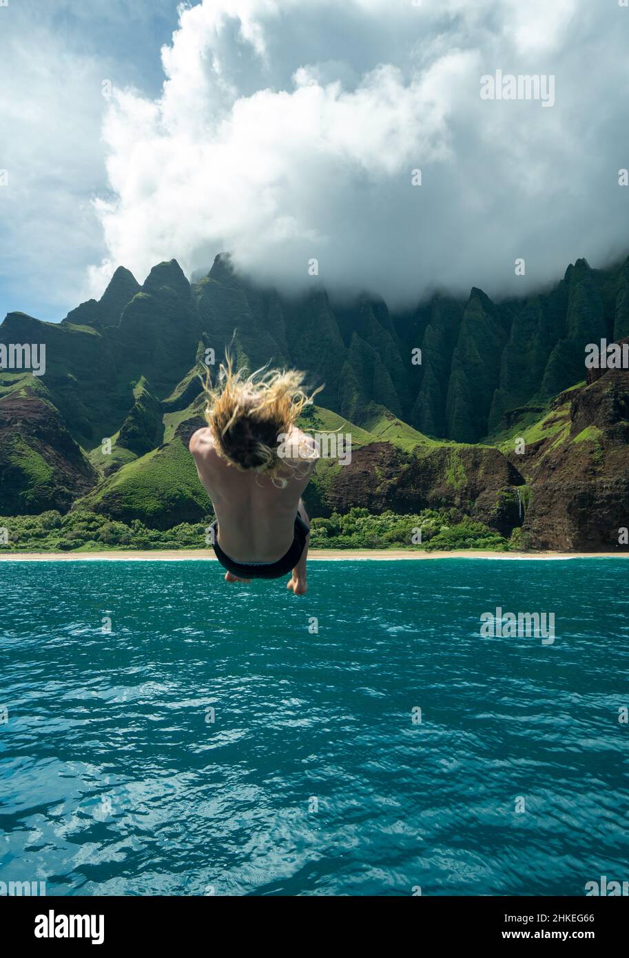 Cliff jumping into ocean sunset hi-res stock photography and images - Alamy