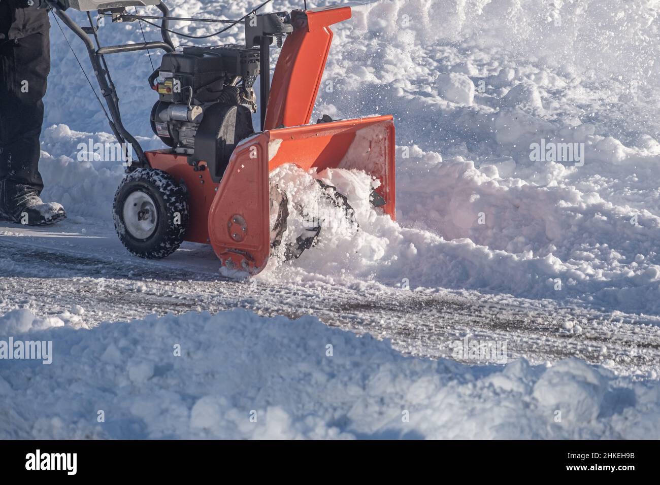 cordless electric snow blower clearing pavement in winter Stock Photo ...