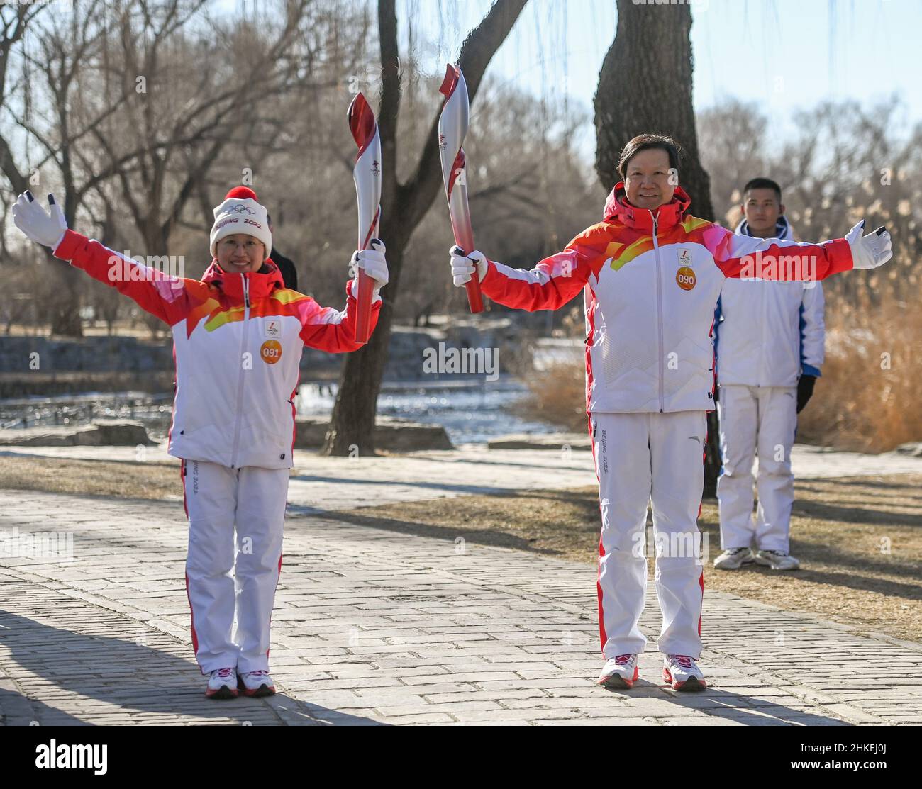 Beijing, China. 4th Feb, 2022. Torch bearer Lei Jun(R front) and Li ...