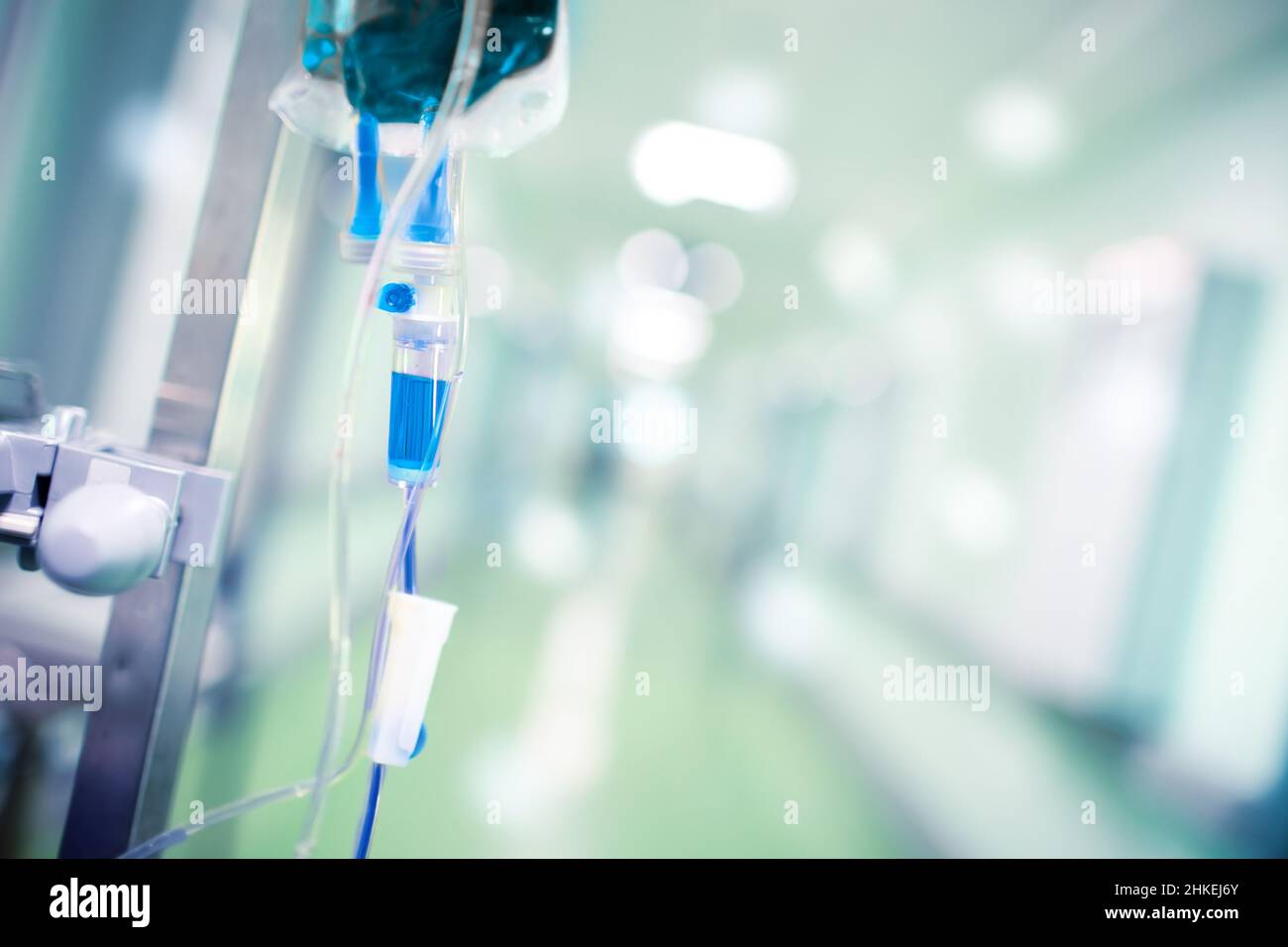 Blue intravenous drip in the hospital foyer as a concept of assisted ...