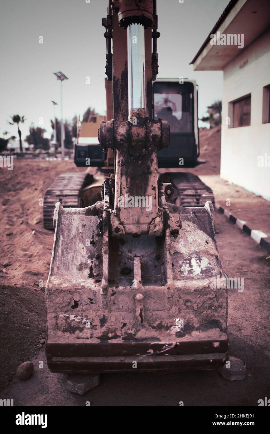 Chain excavator with dirty bucket on the construction site Stock Photo ...