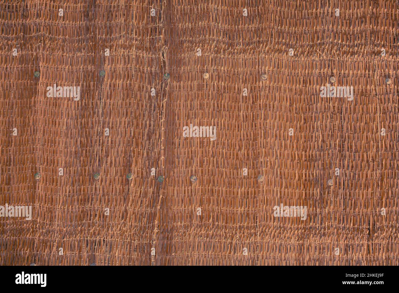 Straw woven fabric with uneven dusty structure, textured background ...