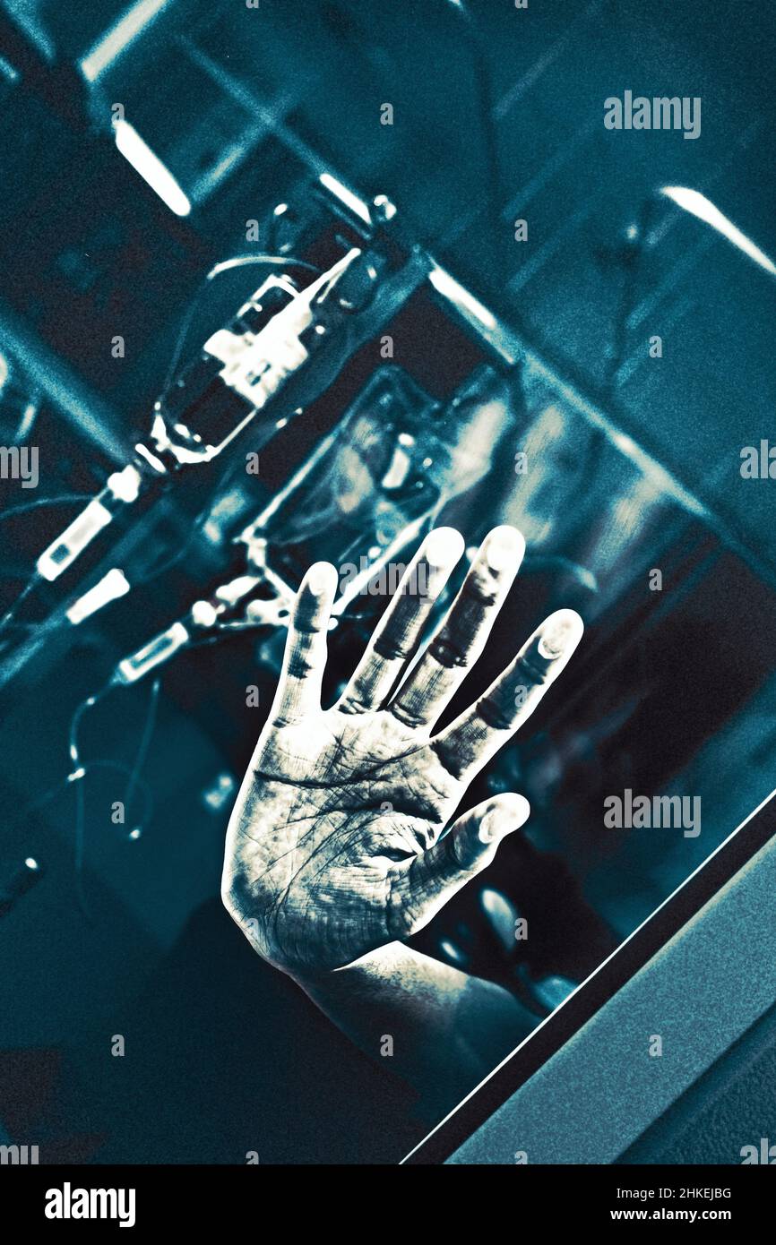 Wrinkled palm of a patient pressed to the window glass, concept of ...
