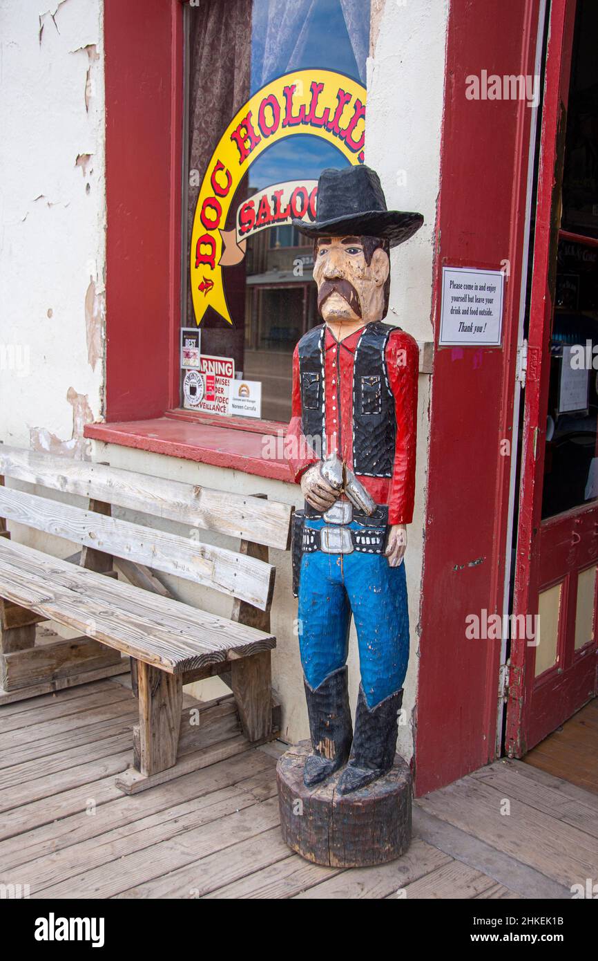 A wood cowboy standing outside of a business as a marketing tool ...