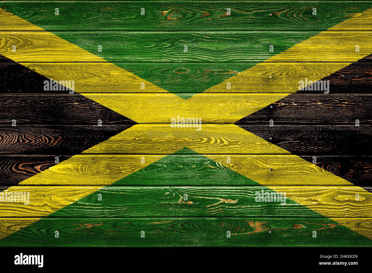 The national flag of Jamaica is painted on a camp of even boards nailed ...