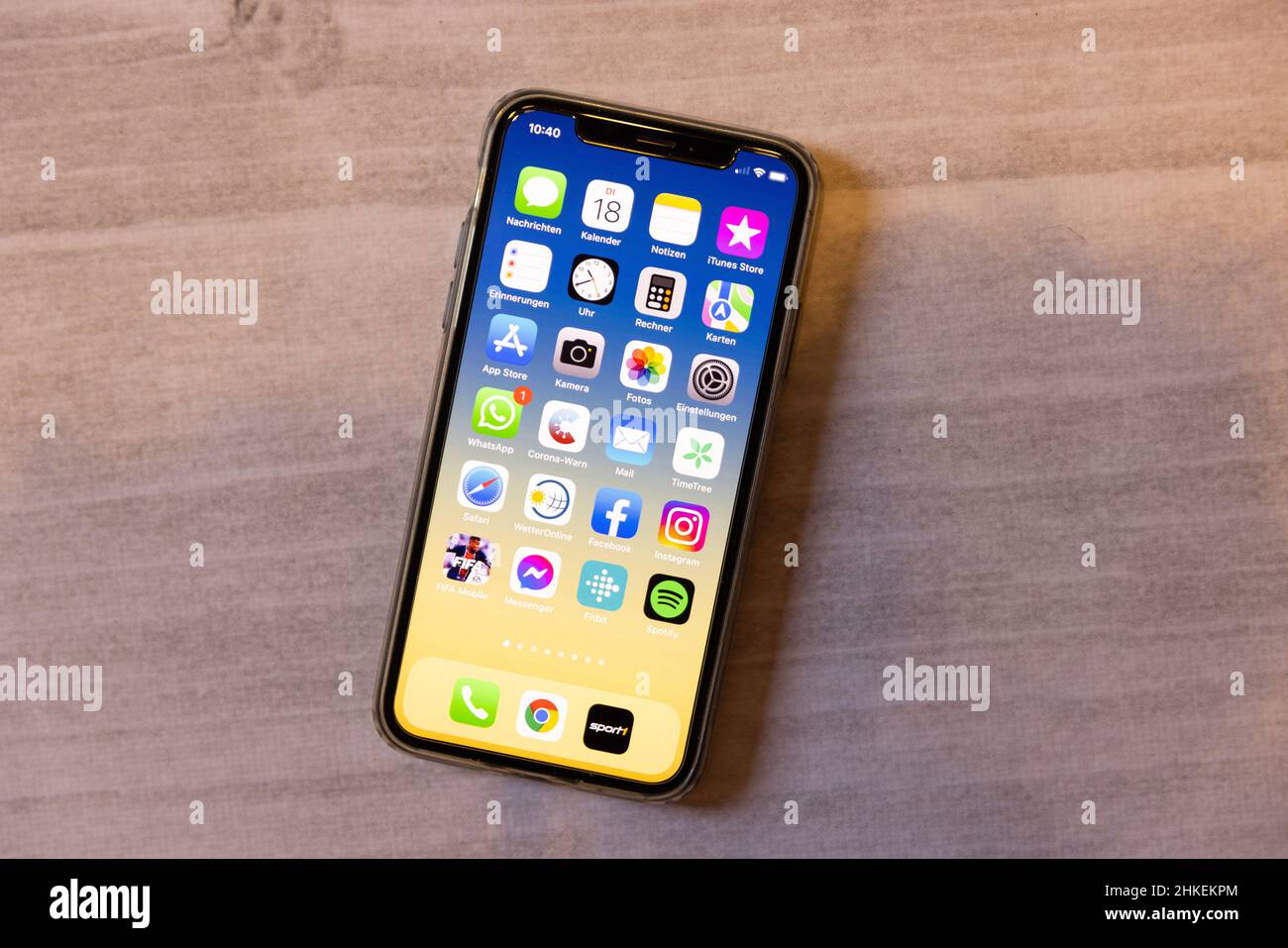 Top view of iPhone X with various applications on the screen on a table ...