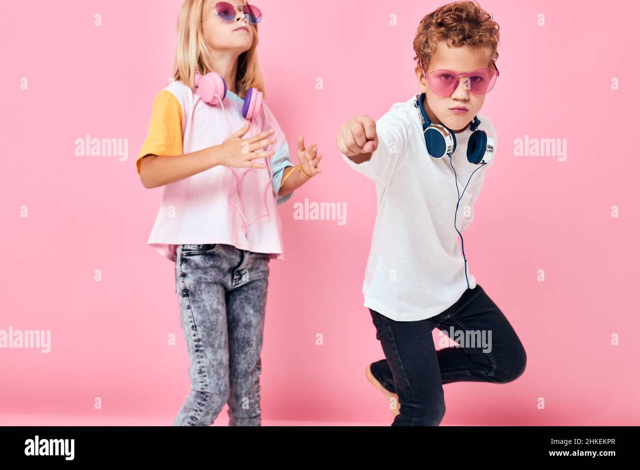 adorable little kids in sunglasses have fun with friends studio posing ...