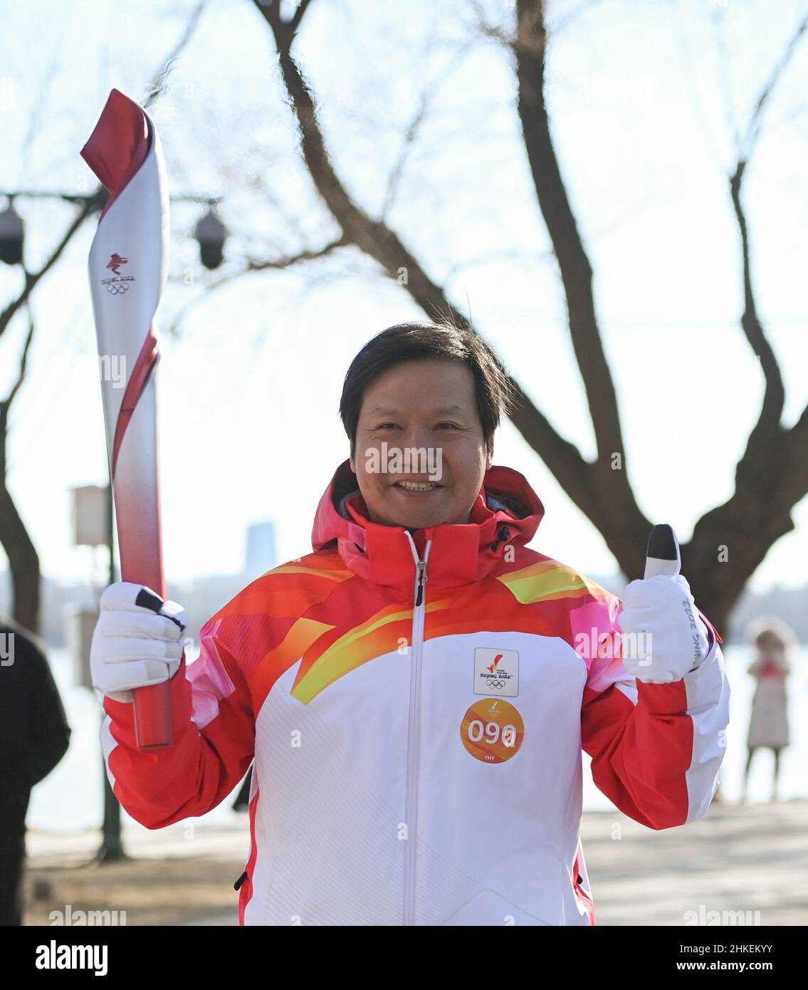 Beijing, China. 4th Feb, 2022. Torch bearer Lei Jun runs with the torch ...