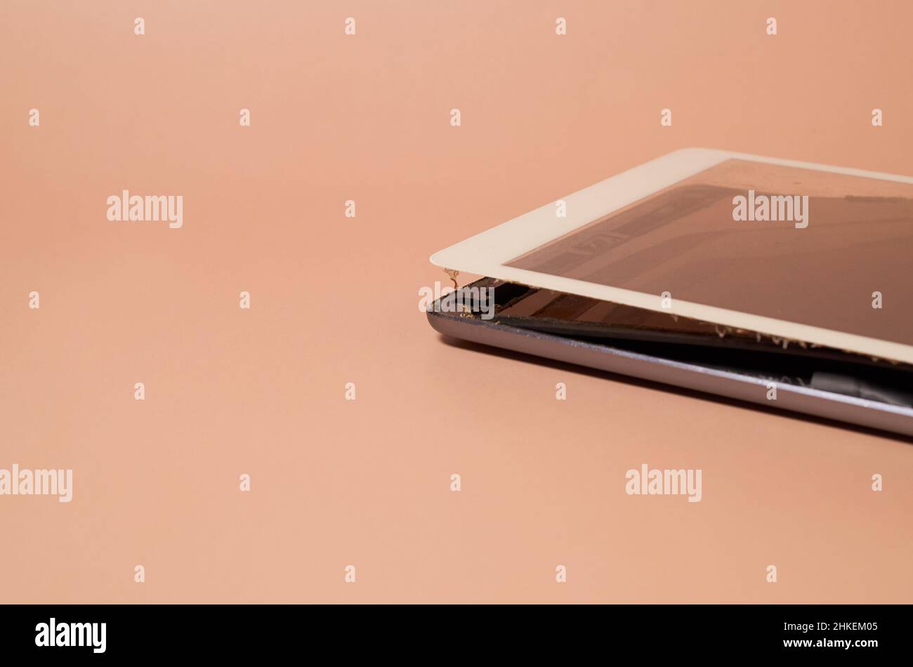 A broken tablet with a swollen battery and a dirty screen Stock Photo ...