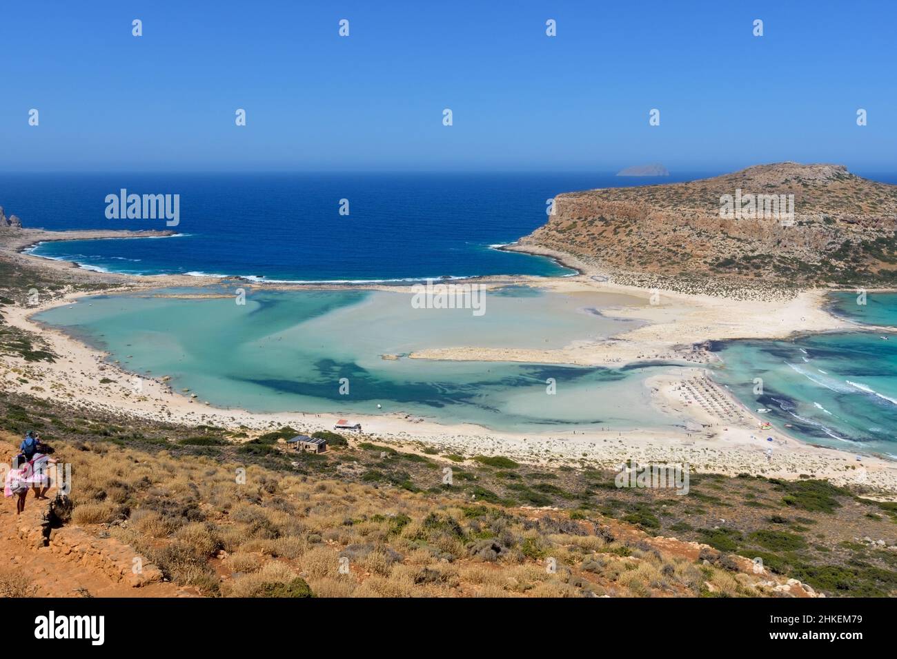 Visitors looking at the amazing view of Balos tropical Beach and Lagoon ...
